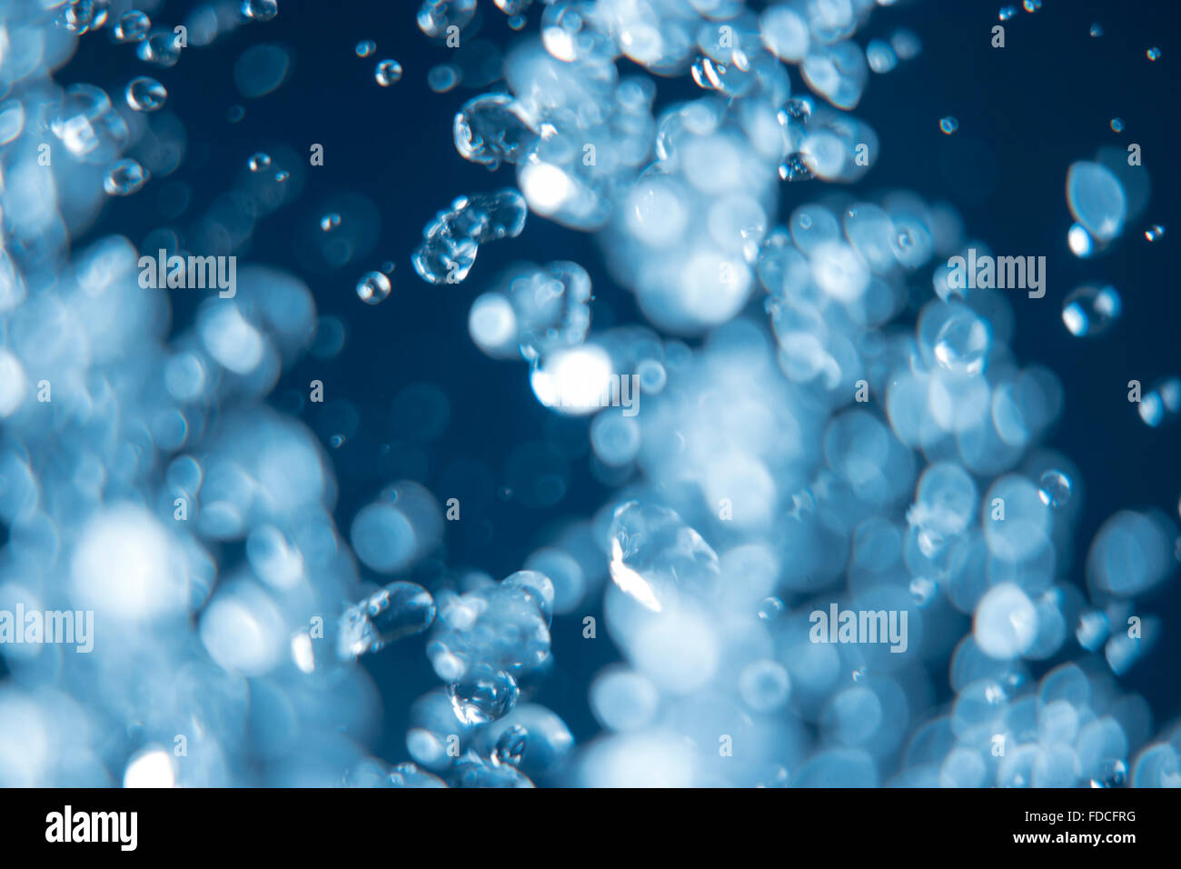 Blue water drops levitation background Stock Photo - Alamy