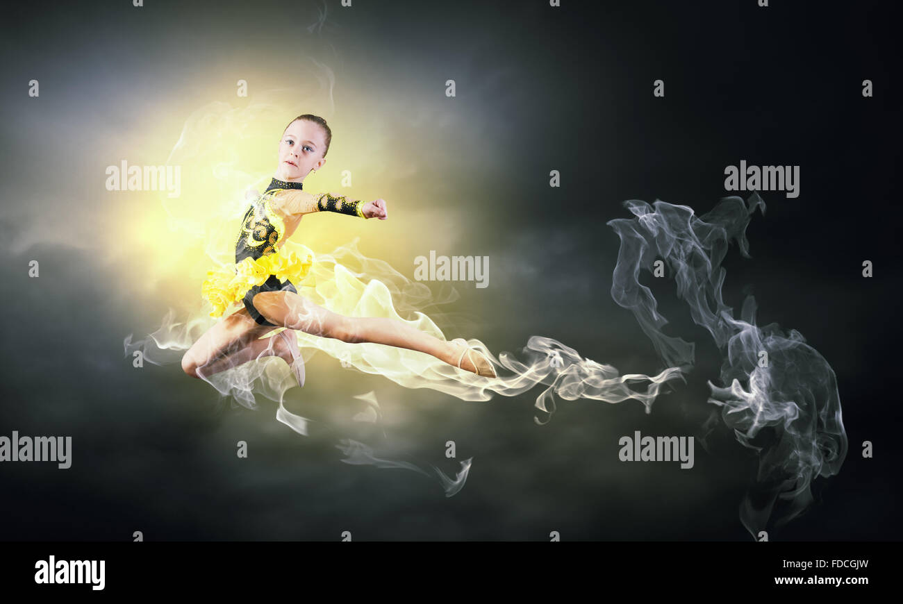 Little cute girl gymnast making high jump Stock Photo - Alamy