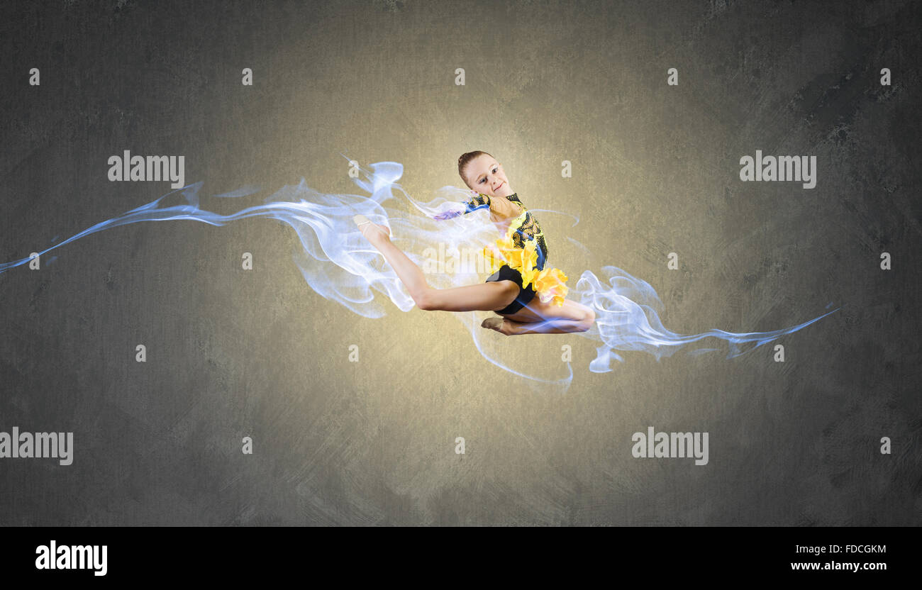 Little cute girl gymnast making high jump Stock Photo - Alamy