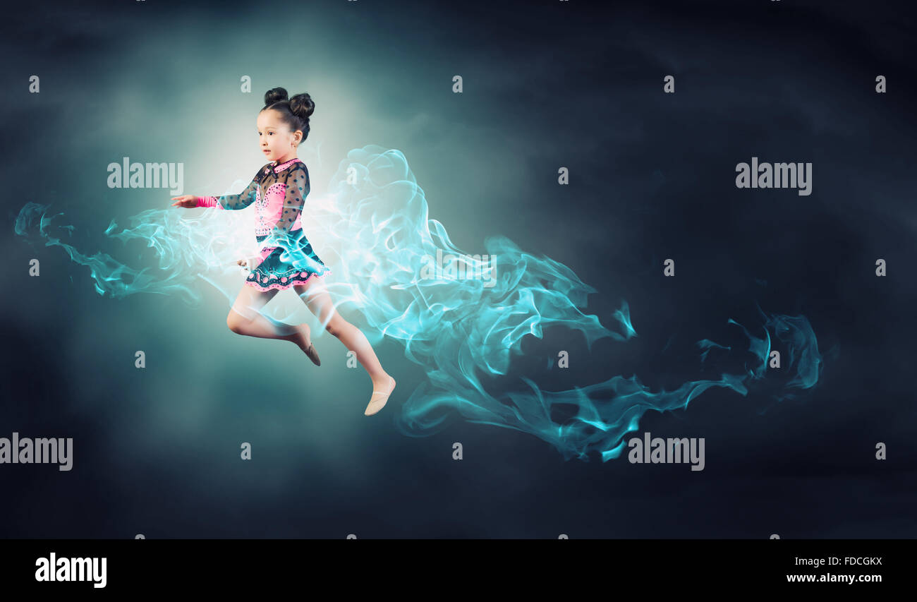 Little cute girl gymnast making high jump Stock Photo - Alamy