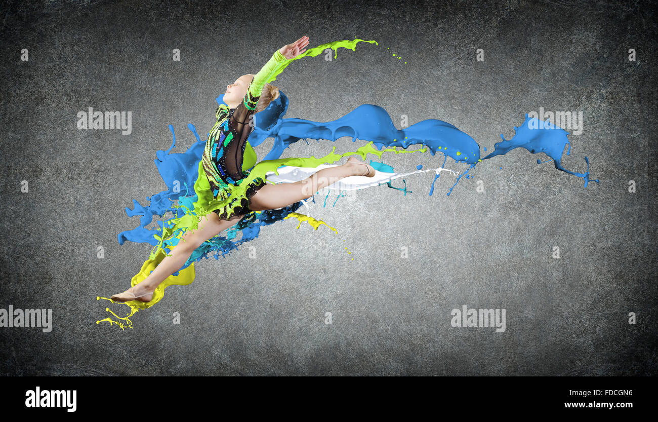 Little cute girl gymnast making high jump Stock Photo - Alamy