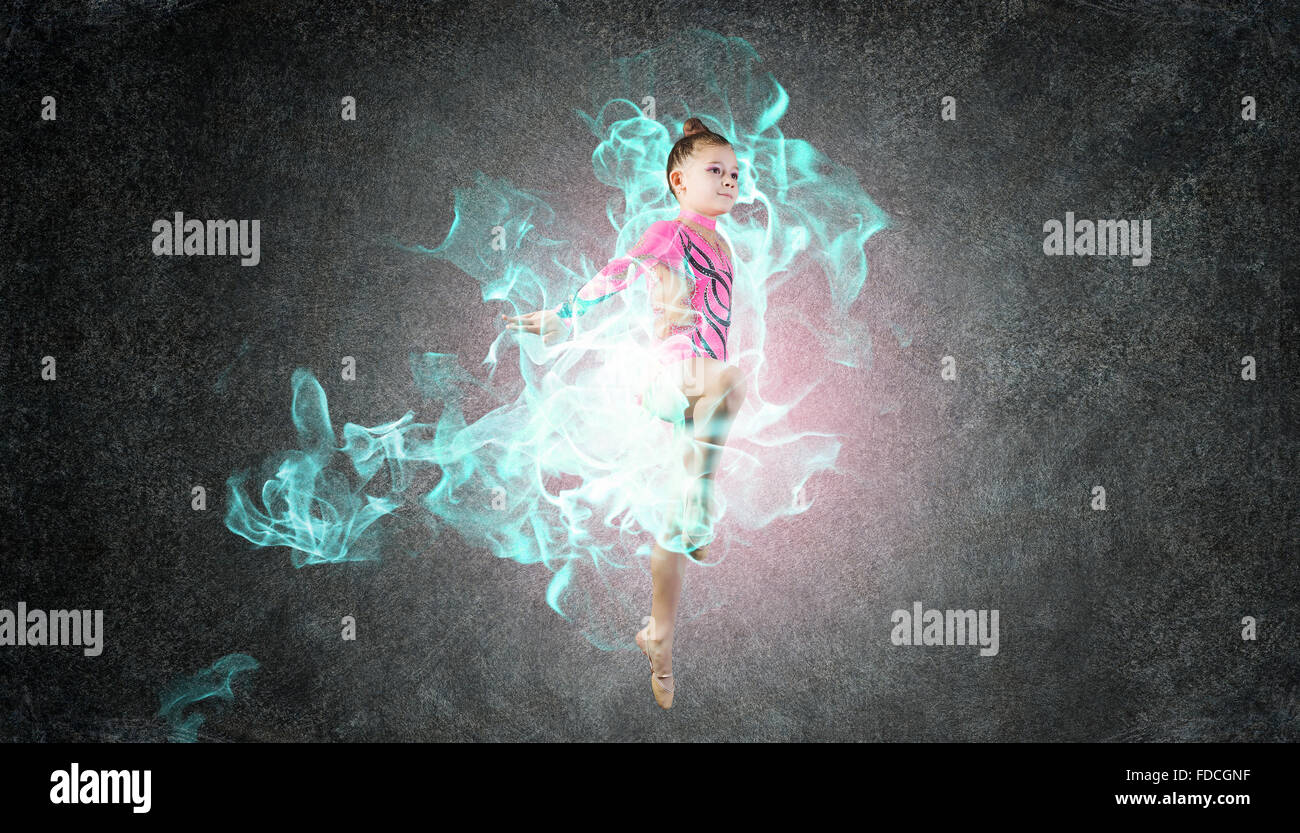 Little cute girl gymnast making high jump Stock Photo - Alamy