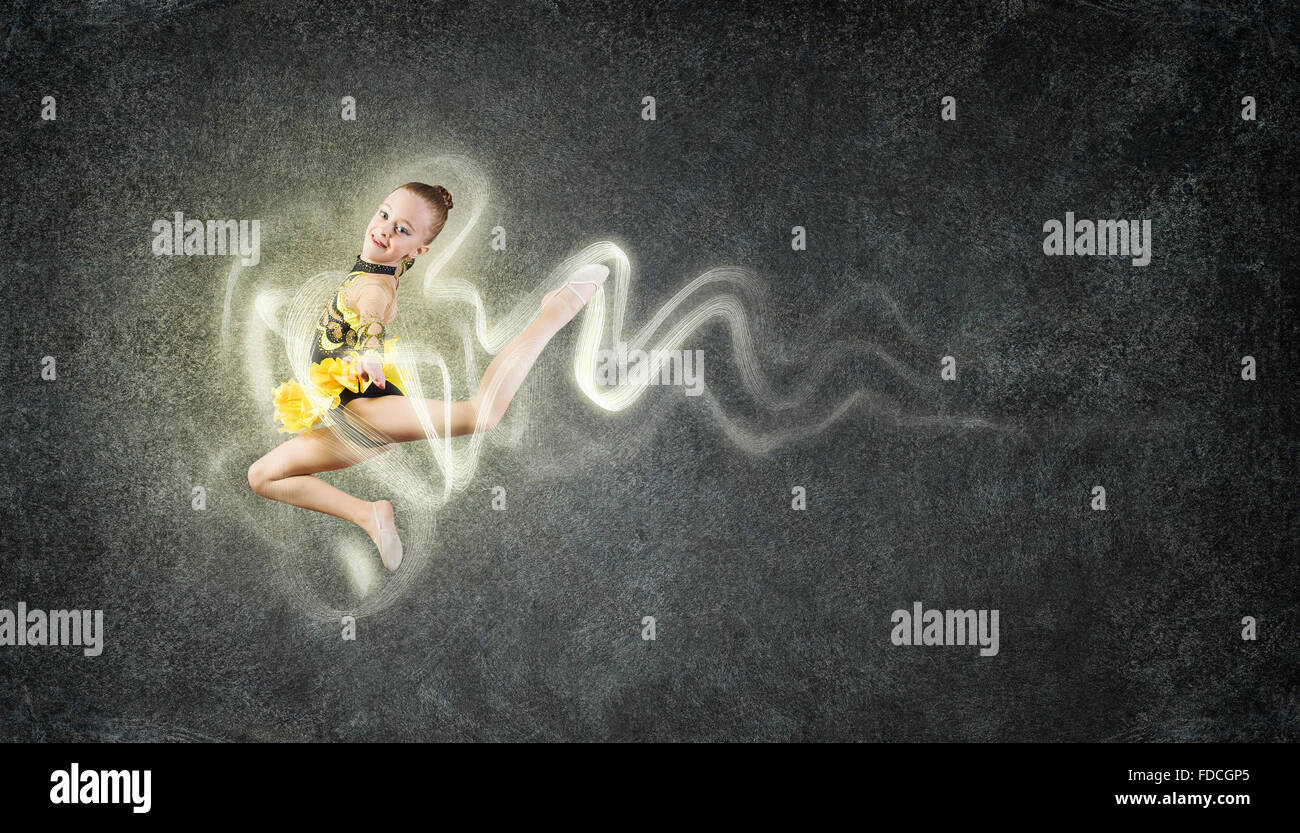 Little cute girl gymnast making high jump Stock Photo - Alamy