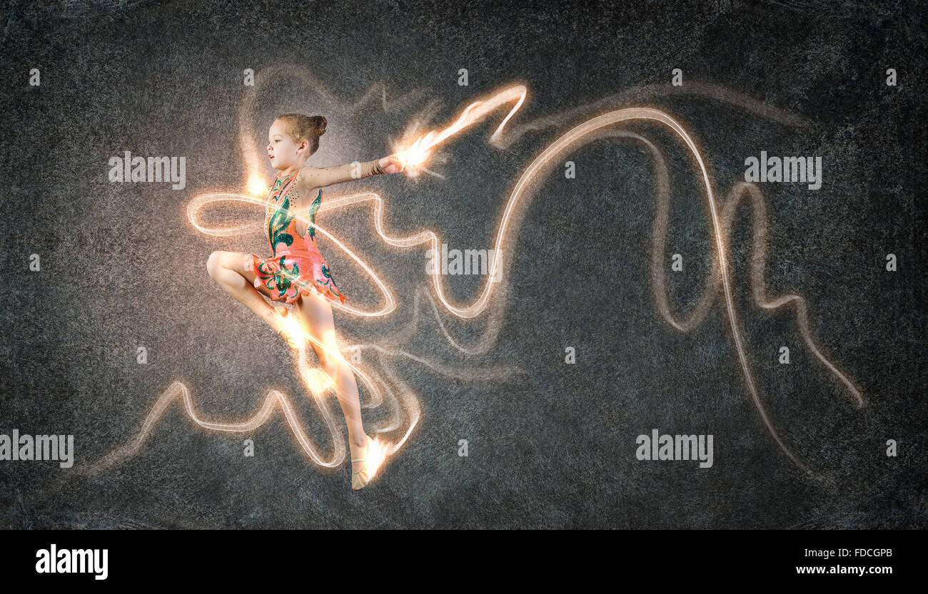 Little cute girl gymnast making high jump Stock Photo - Alamy