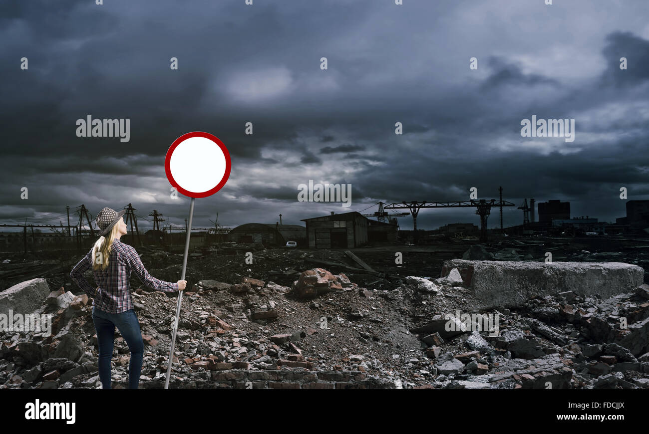 Young girl in casual holding stop sign Stock Photo - Alamy