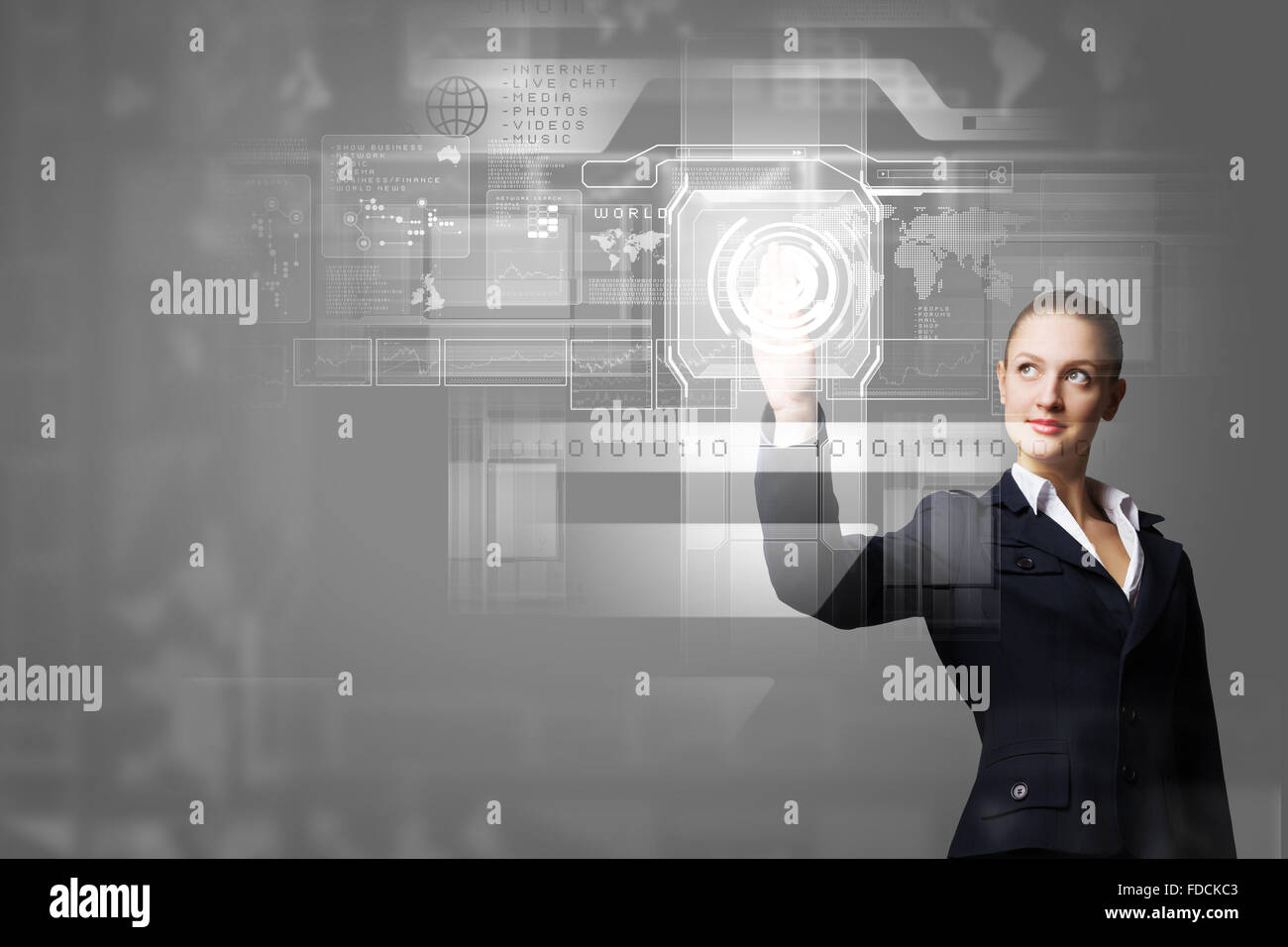 Attractive businesswoman touching icon of media screen Stock Photo - Alamy