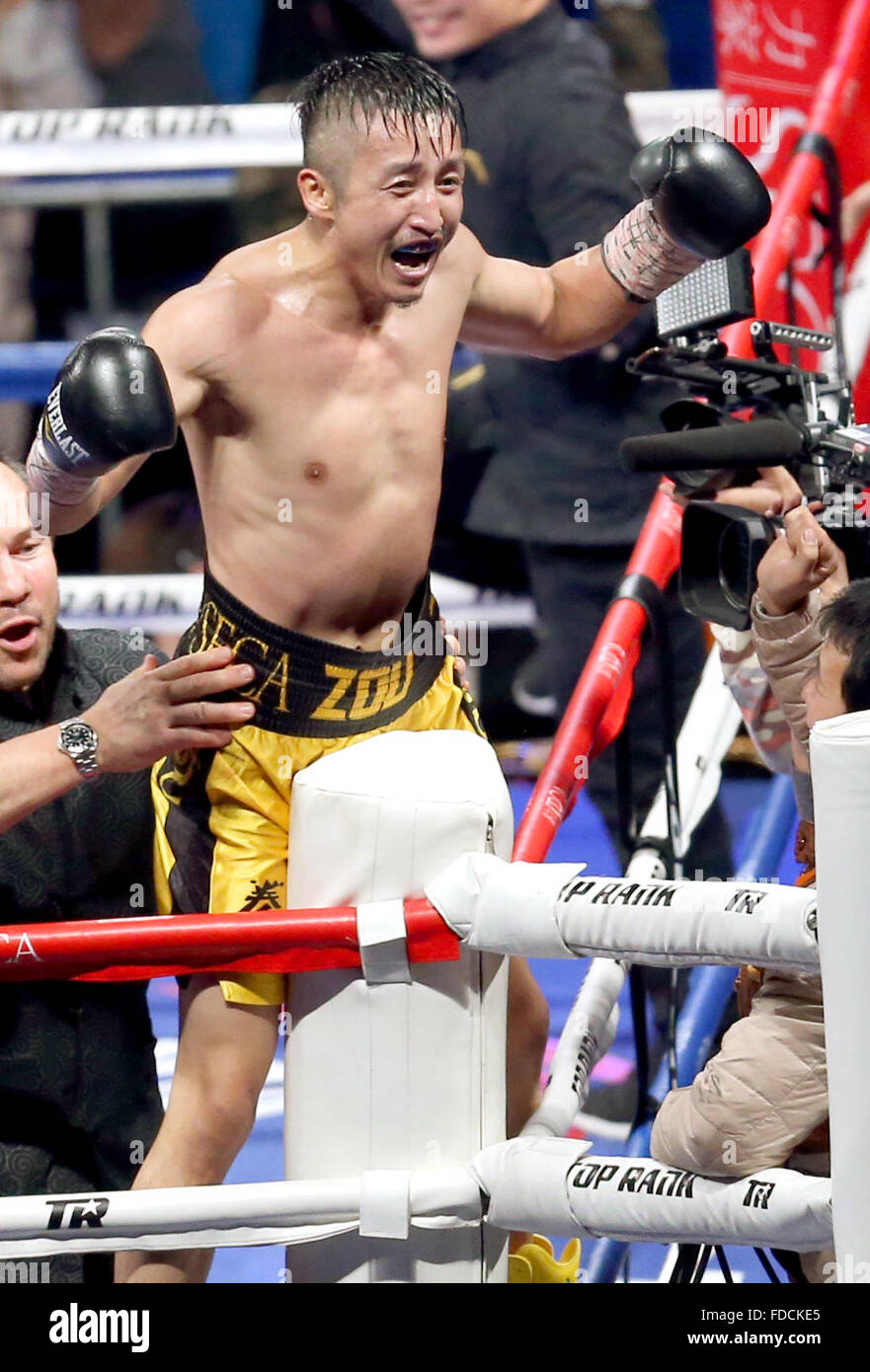 Shanghai, China. 30th Jan, 2016. Zou Shiming of China celebrates after ...