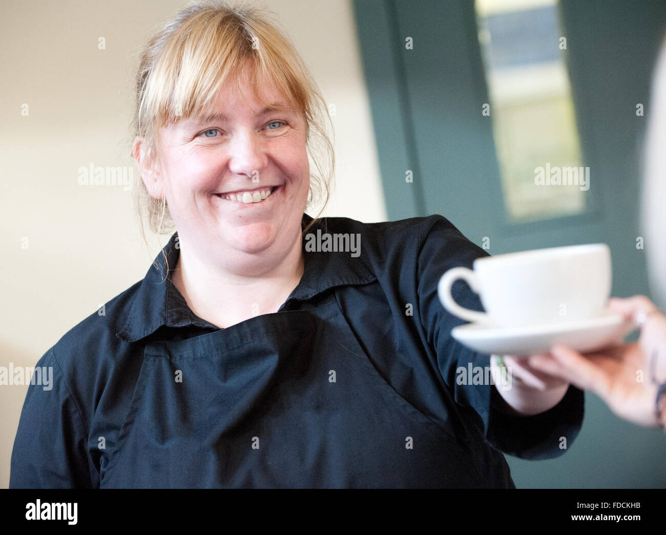 Waitress serving tea hi-res stock photography and images - Alamy