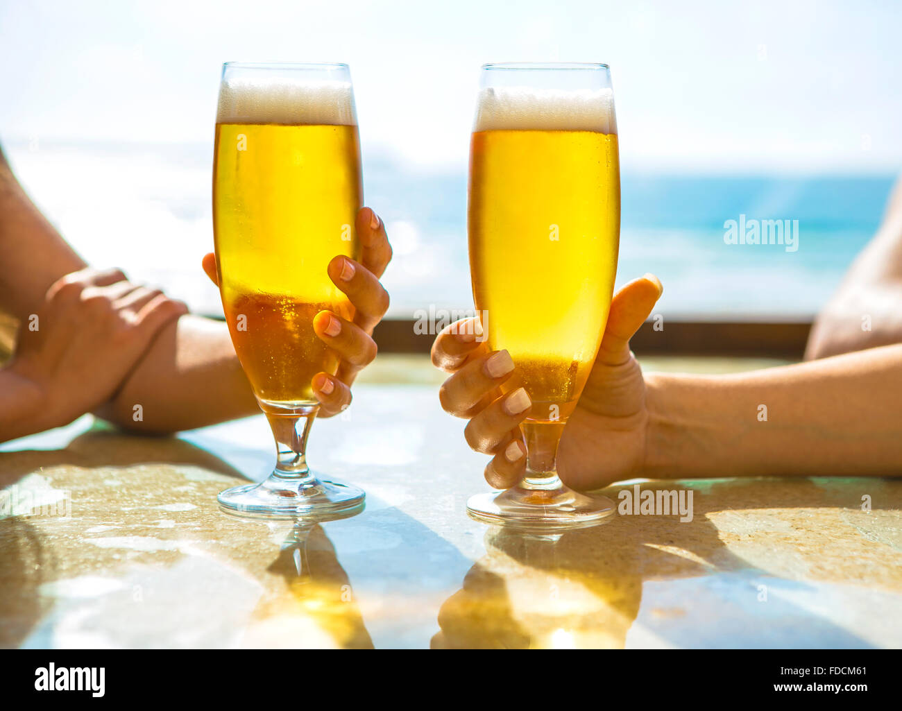 Beer glass cheers friends outside hi-res stock photography and images ...
