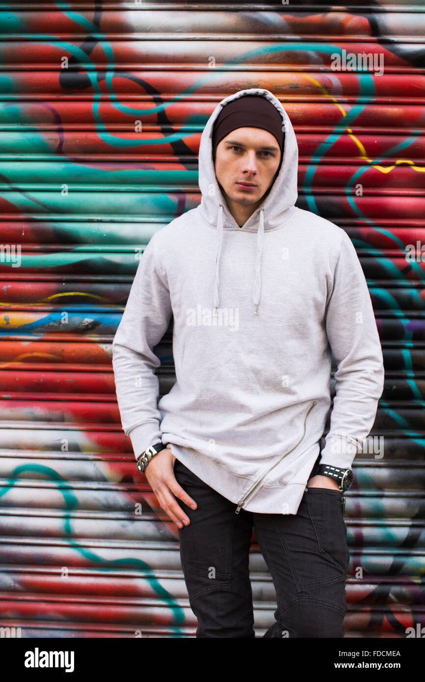 Young male in front of graffiti street art in London Shoreditch Stock ...