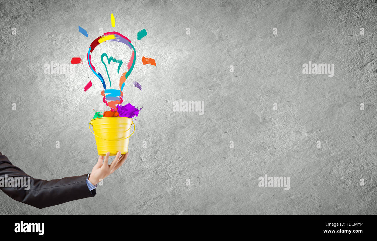 Man holding bucket paint hi-res stock photography and images - Alamy
