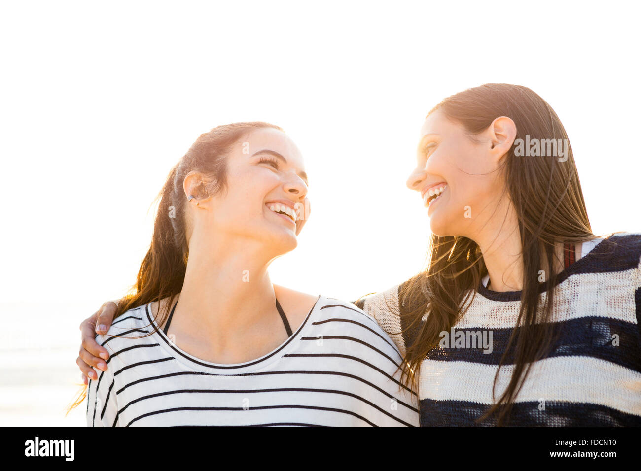 A portrait of best friends laughing Stock Photo - Alamy