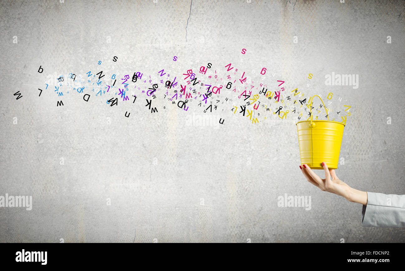 Close up of woman hand holding bucket Stock Photo - Alamy