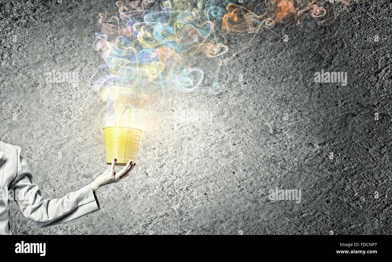 Close up of businesswoman hand holding bucket with loops Stock Photo ...