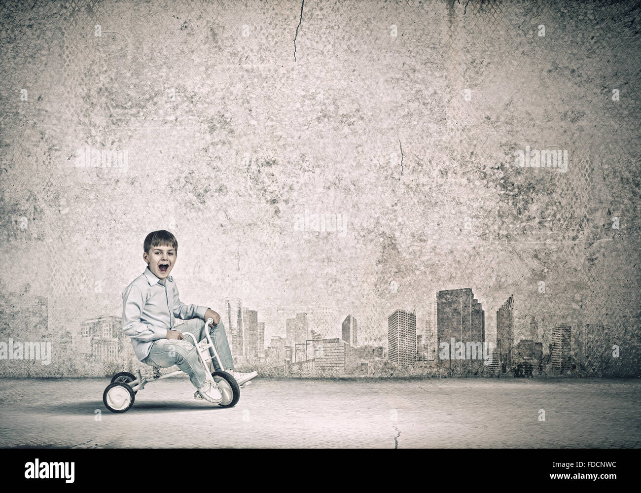 Little joyful cute boy riding tricycle on road Stock Photo - Alamy