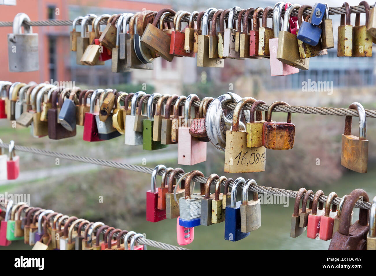 Love locks hanging from bridge railing Stock Photo - Alamy