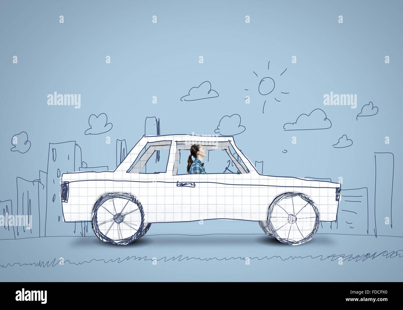 Young girl driving car made of paper Stock Photo - Alamy