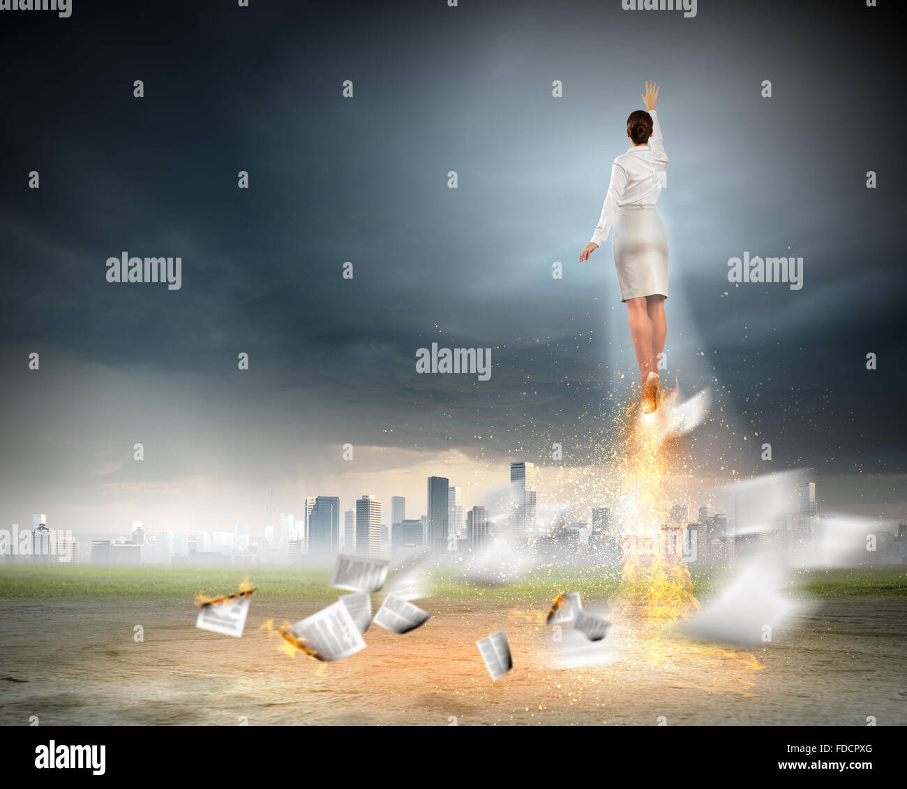 Businesswoman on lead trying to fly away Stock Photo - Alamy