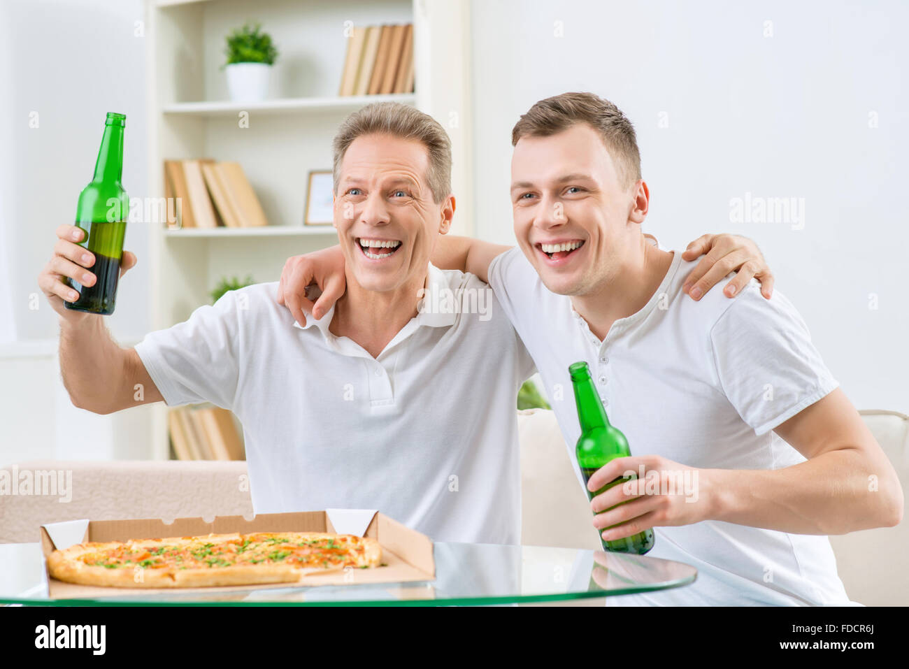 Father and adult son drinking beer Stock Photo - Alamy
