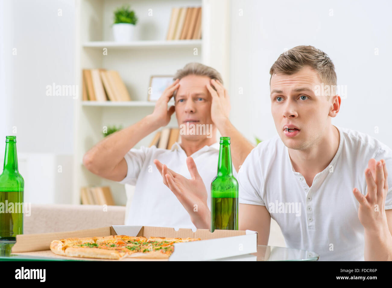 Father and adult son drinking beer Stock Photo - Alamy