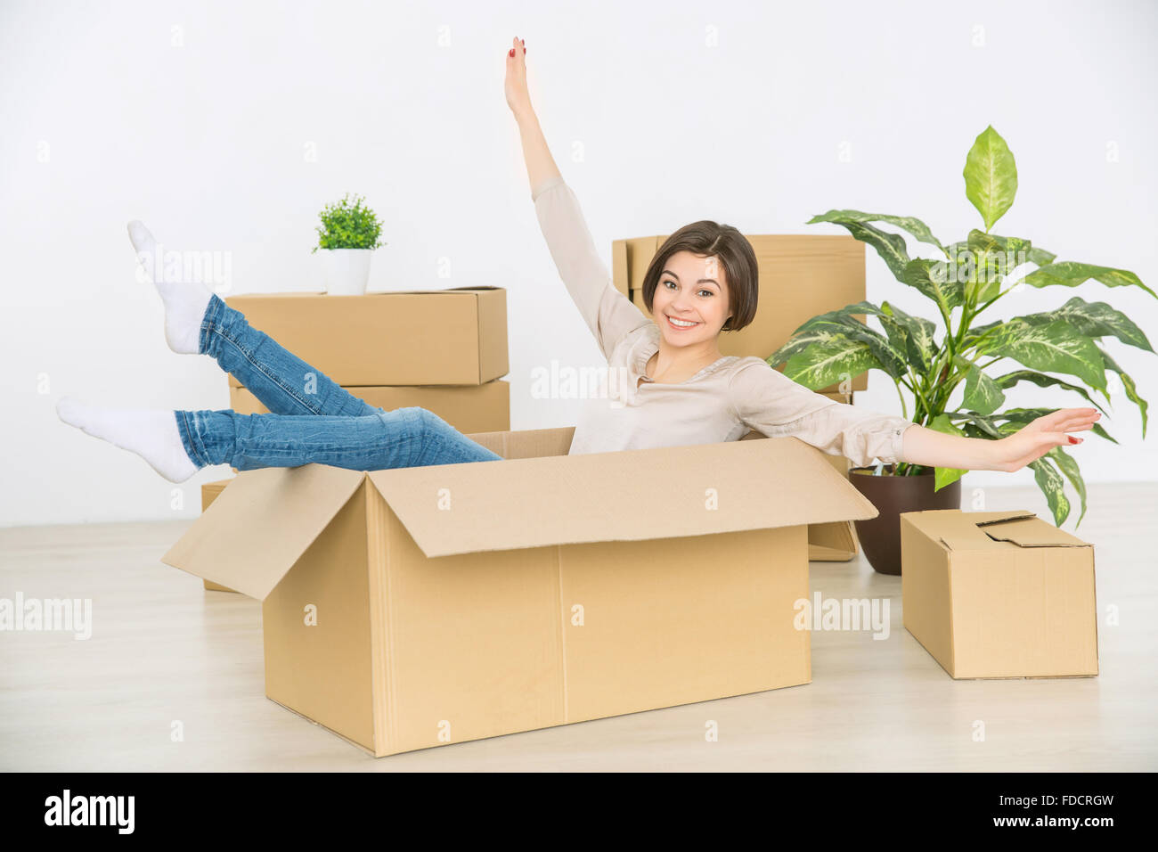 Pleasant beautiful lady lying in a big box Stock Photo - Alamy