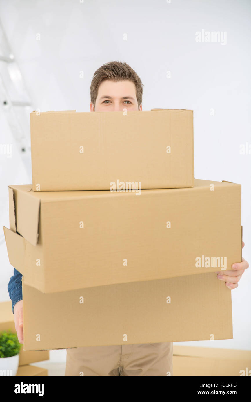 Pleasant man holding boxes Stock Photo - Alamy