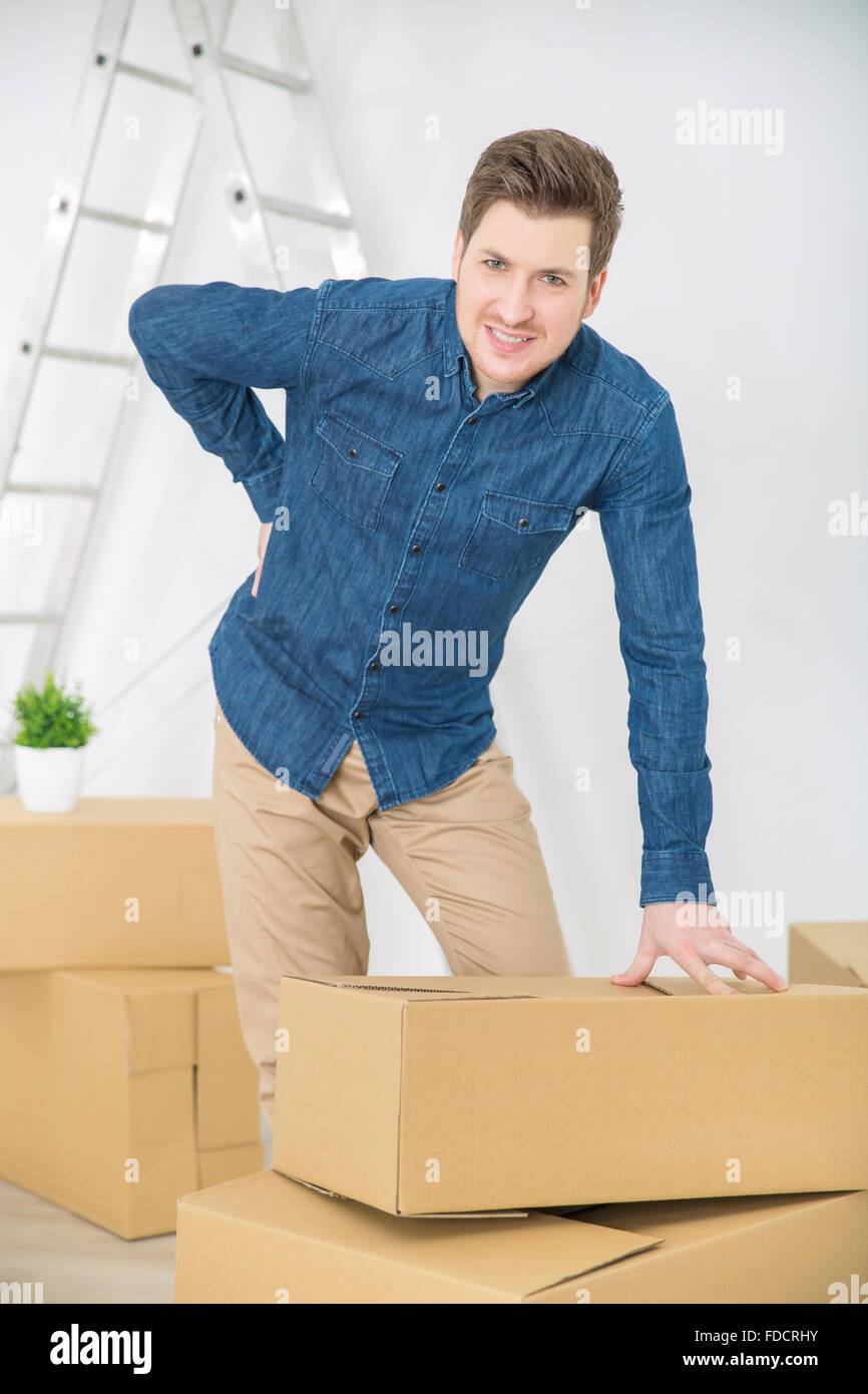 Pleasant man packing the boxes Stock Photo - Alamy
