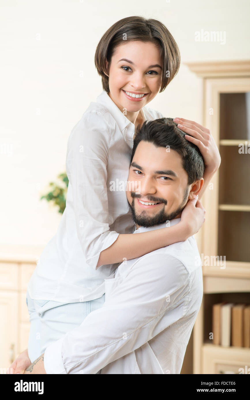Handsome husband holding his wife Stock Photo - Alamy