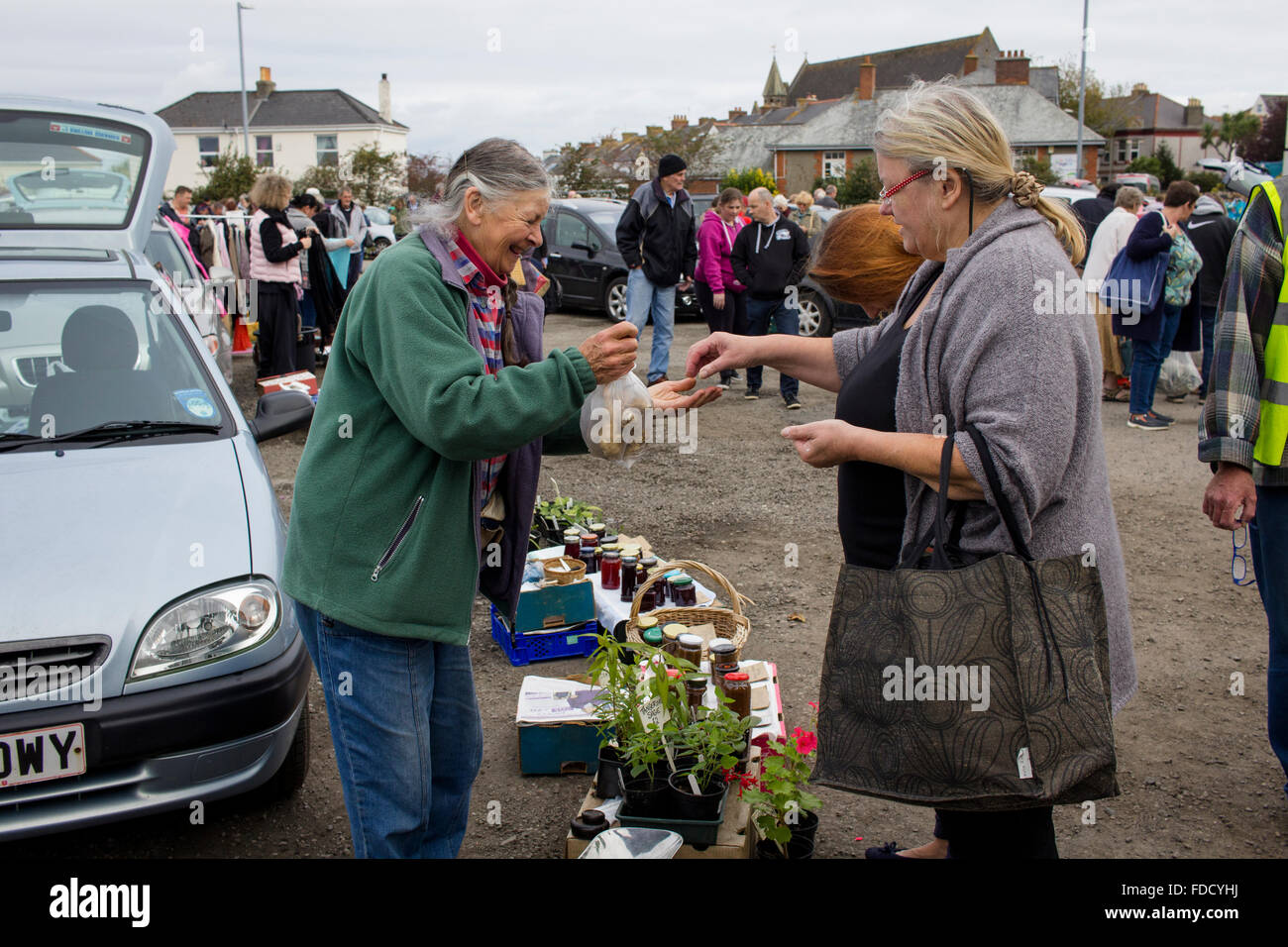 A cash exchange at Falmouth boot fair, Cornwall Stock Photo - Alamy