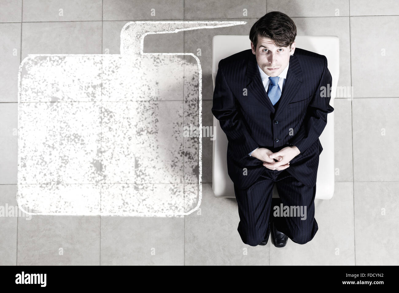 Top view of thoughtful businessman sitting on chair Stock Photo - Alamy