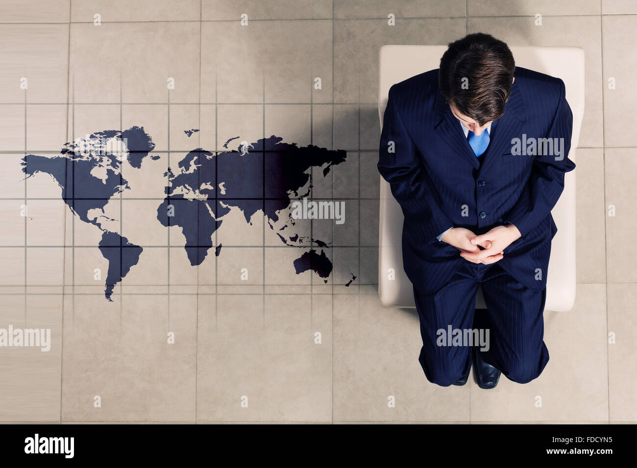 Top view of thoughtful businessman sitting on chair Stock Photo - Alamy