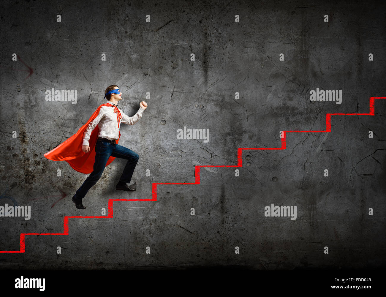Young superman walking up stair hi-res stock photography and images - Alamy