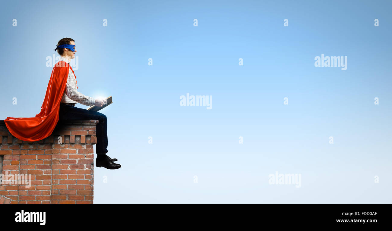 Superhero reading hi-res stock photography and images - Alamy