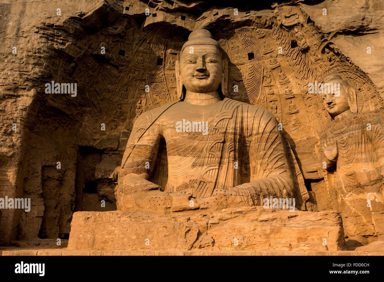 Outdoor Stone Buddha statue at Yungang caves, Datong, Shanxi province ...