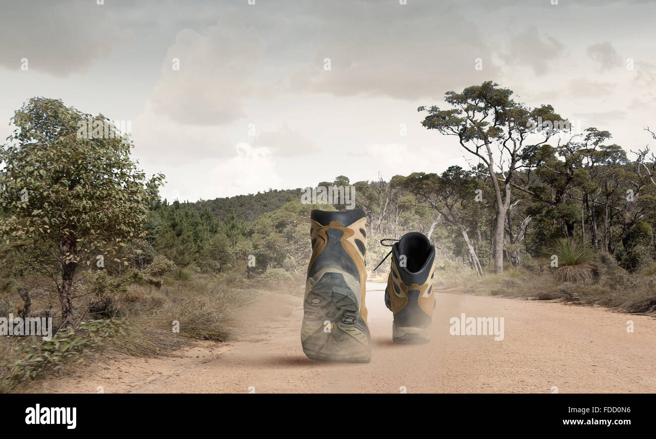 Pair of hikers boots walking on path Stock Photo - Alamy