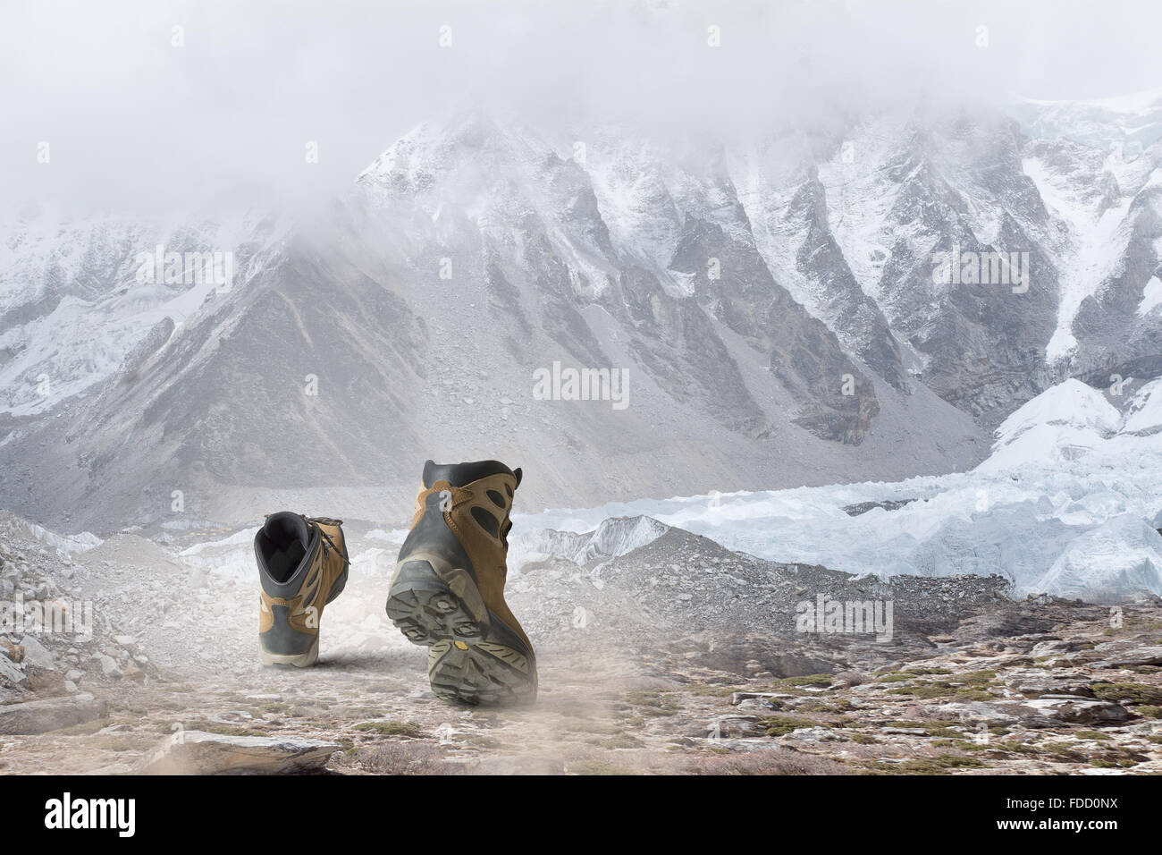 Pair of hikers boots walking on path Stock Photo - Alamy