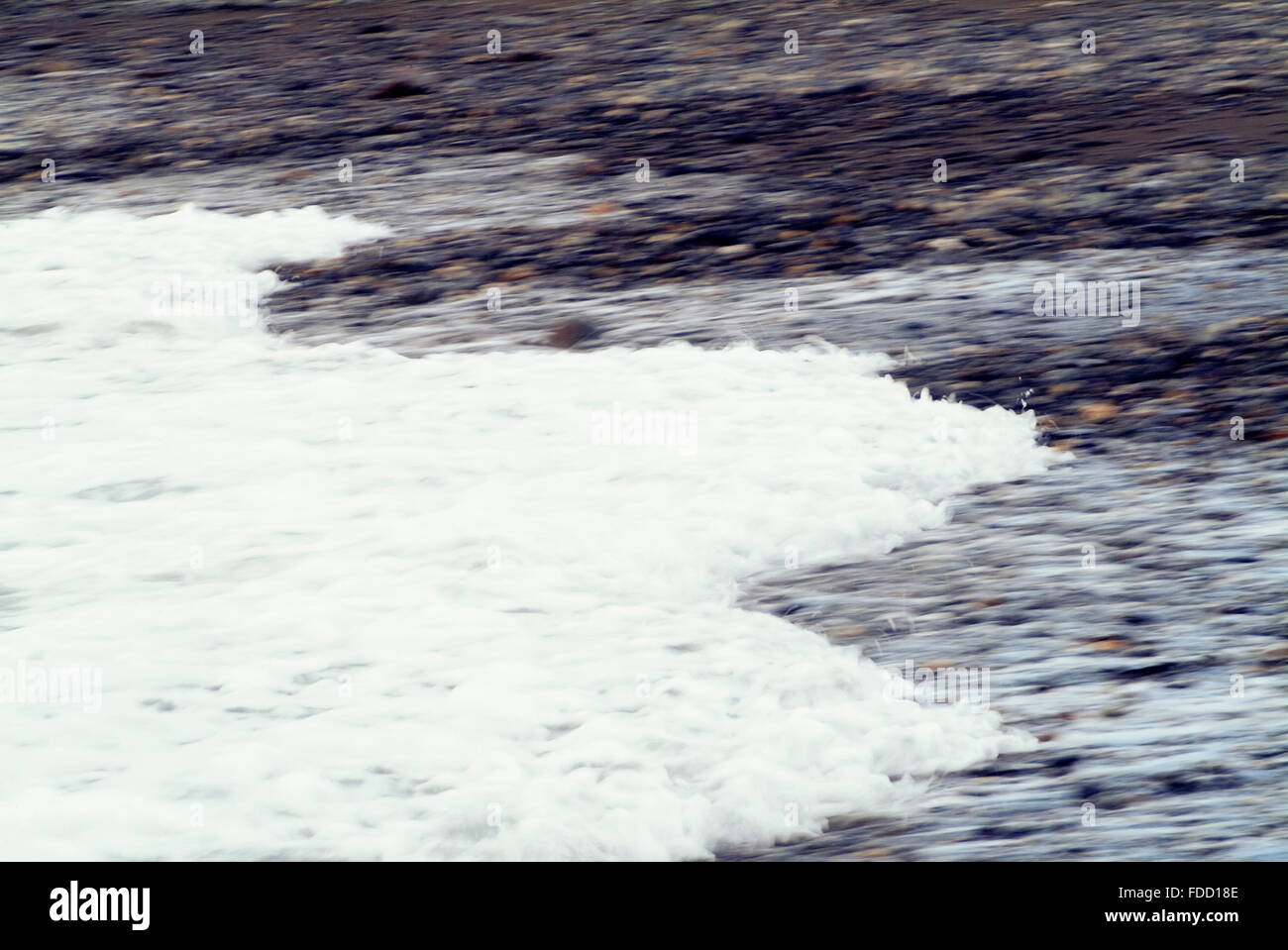 At the sea, water movement of the waves on the beach Stock Photo - Alamy