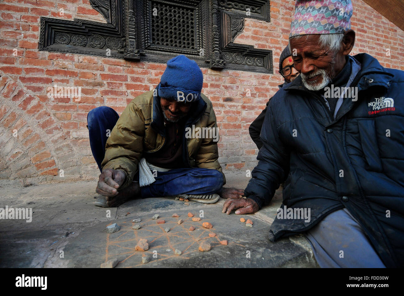 Kathmandu, Nepal. 30th Jan, 2016. Locals playing Bagh-Chal (Tiger) game ...