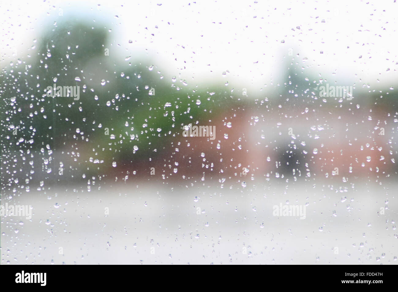 it's raining behind the window in the city Stock Photo - Alamy