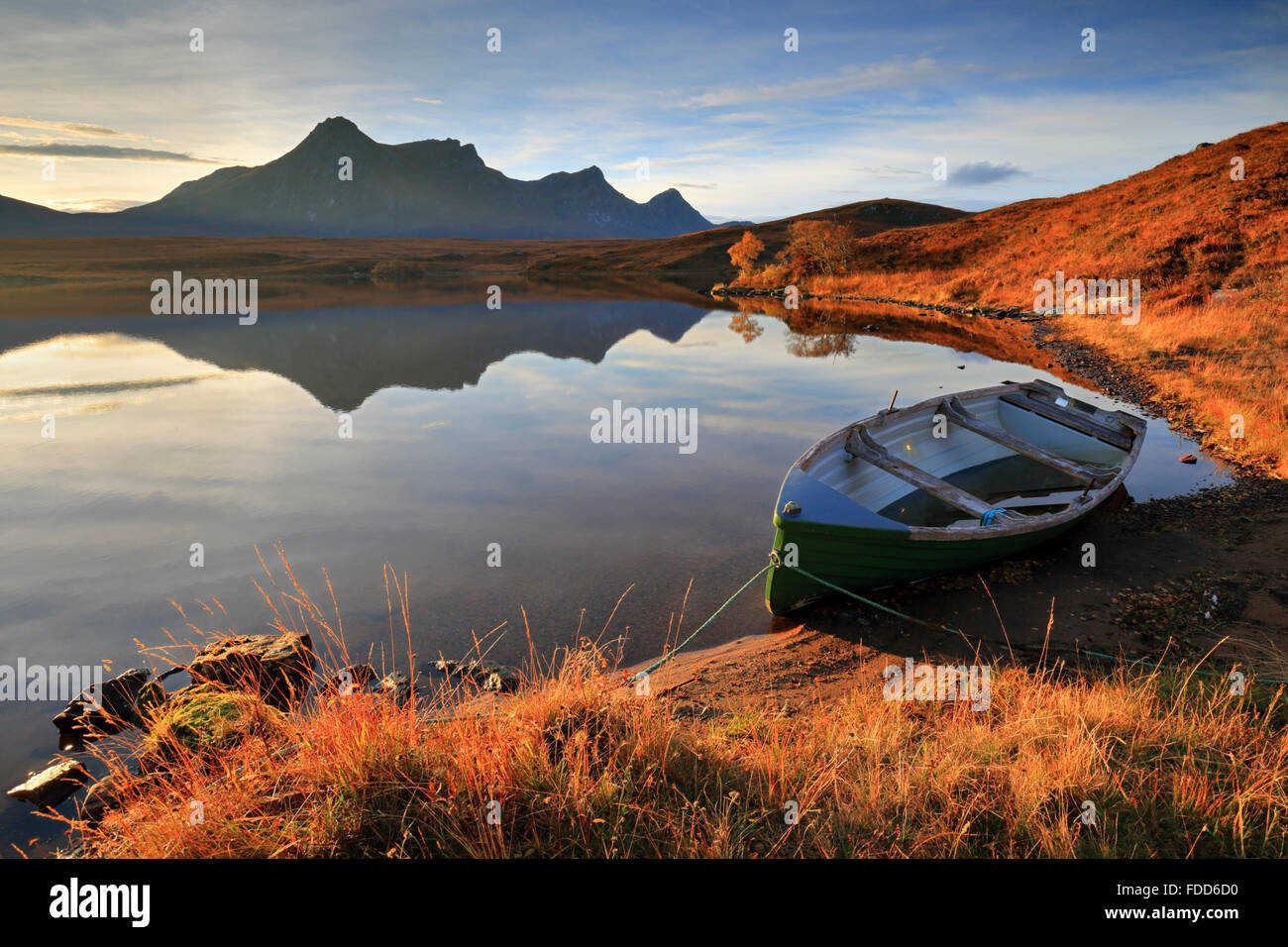 A boat on Loch Hakel near Tongue in North West Scotland, with Ben Loyal ...
