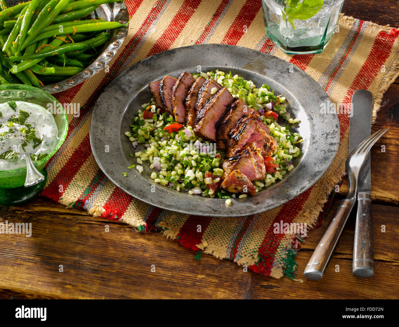 Harissa lamb and tabbouleh Stock Photo - Alamy