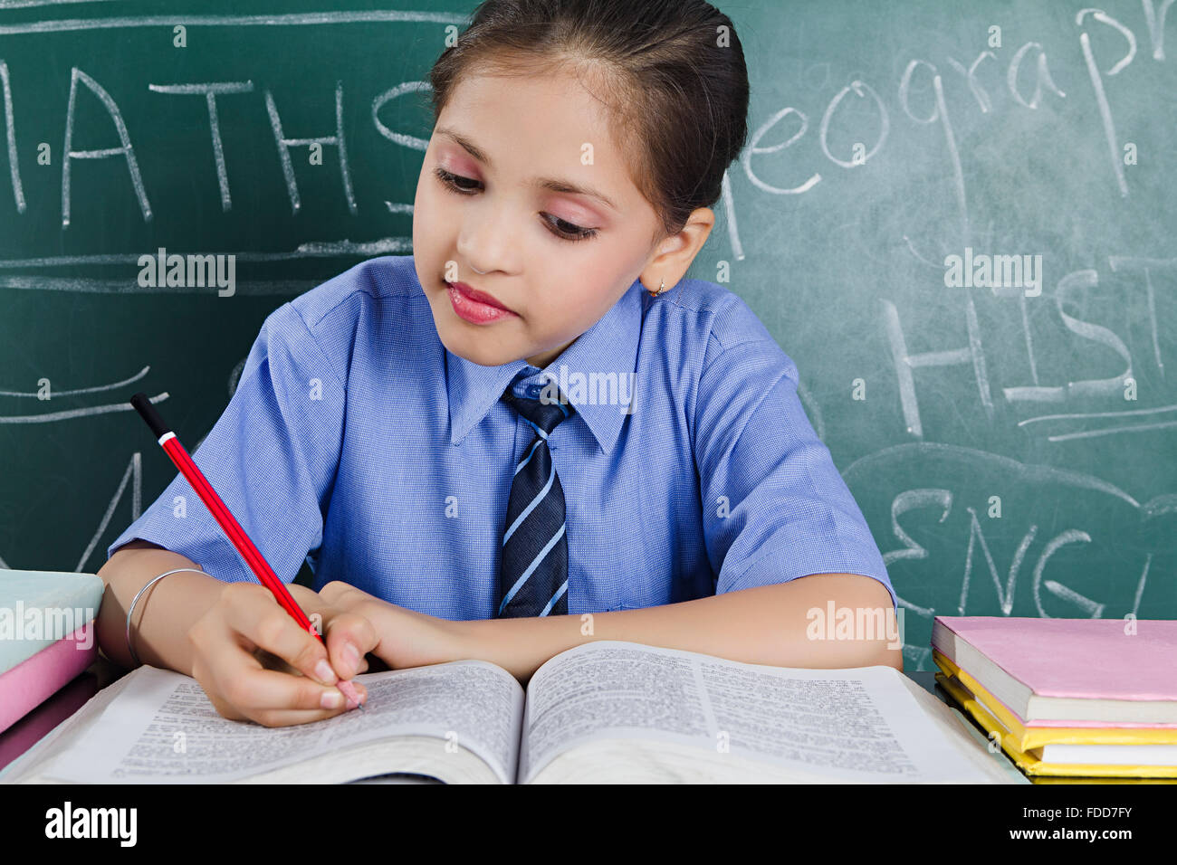 1 Child Girl School Student Classroom Studying Book Writing Stock Photo ...