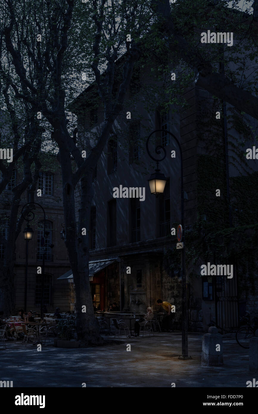 French night scene with people eating under the street lights out side ...