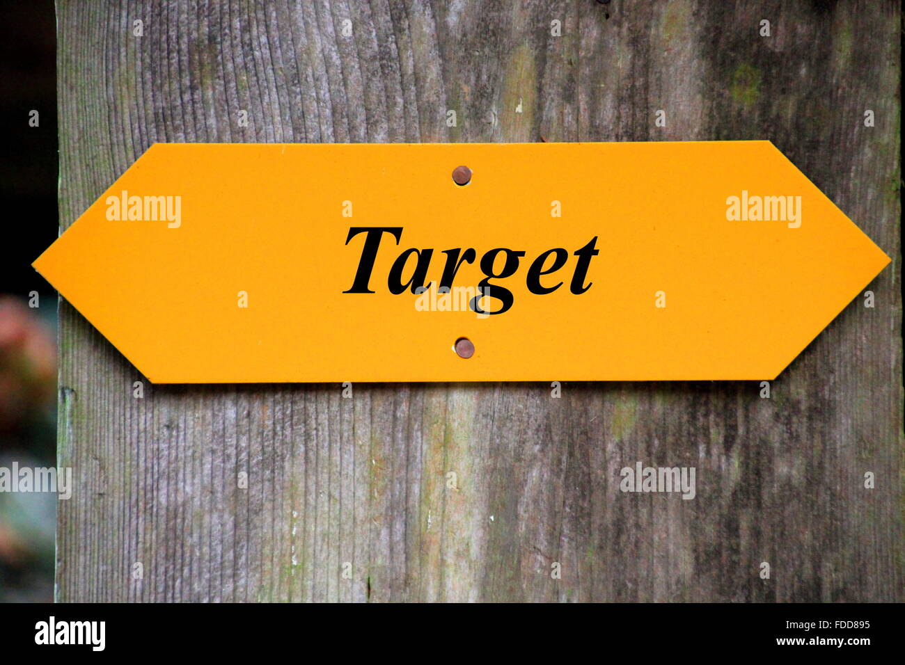 Target written on a yellow direction sign Stock Photo - Alamy