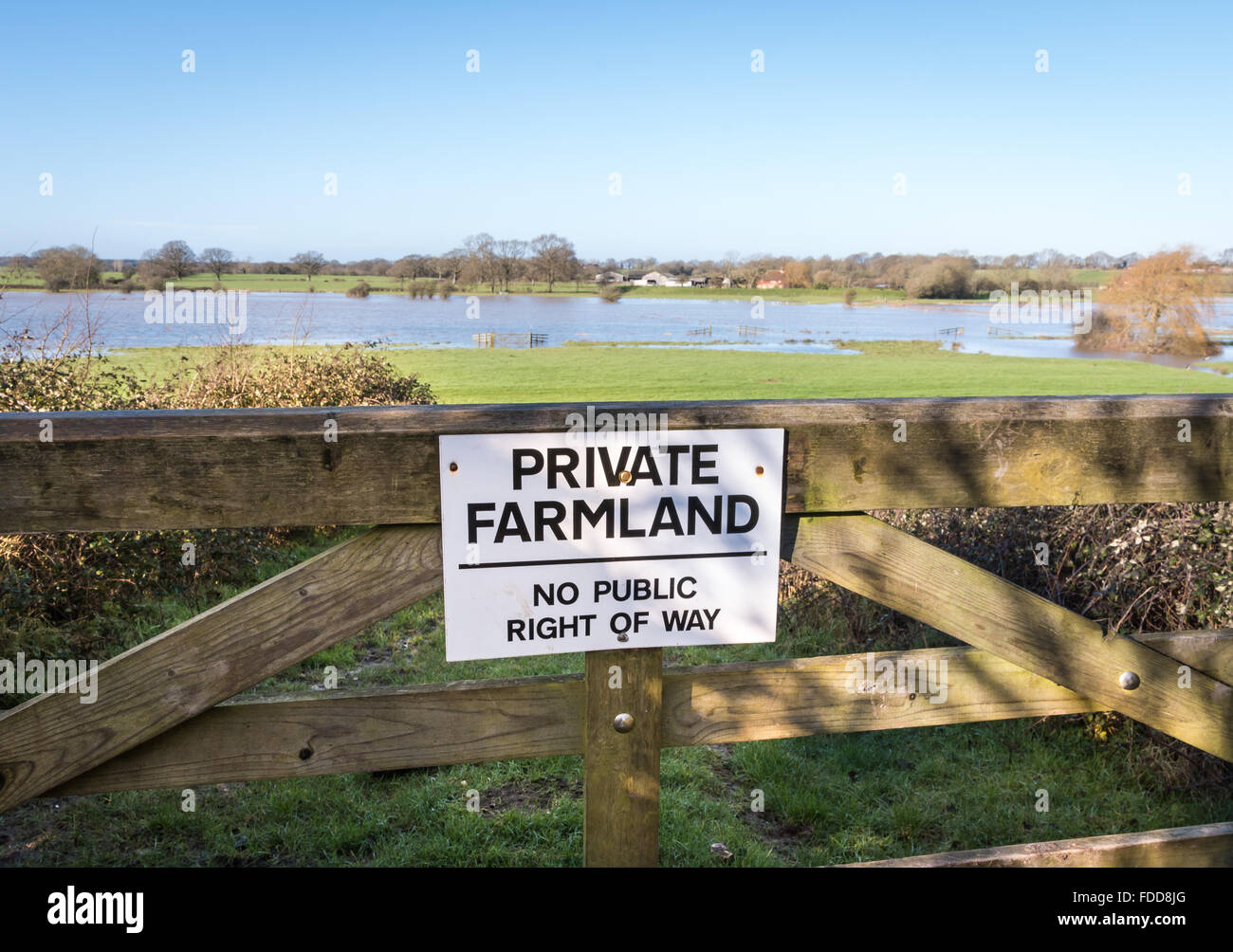 Private Farmland - No Public Right of Way sign on a wooden gate in the ...