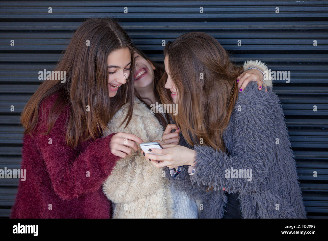 kids sending fun messages with cell or mobile phone Stock Photo - Alamy