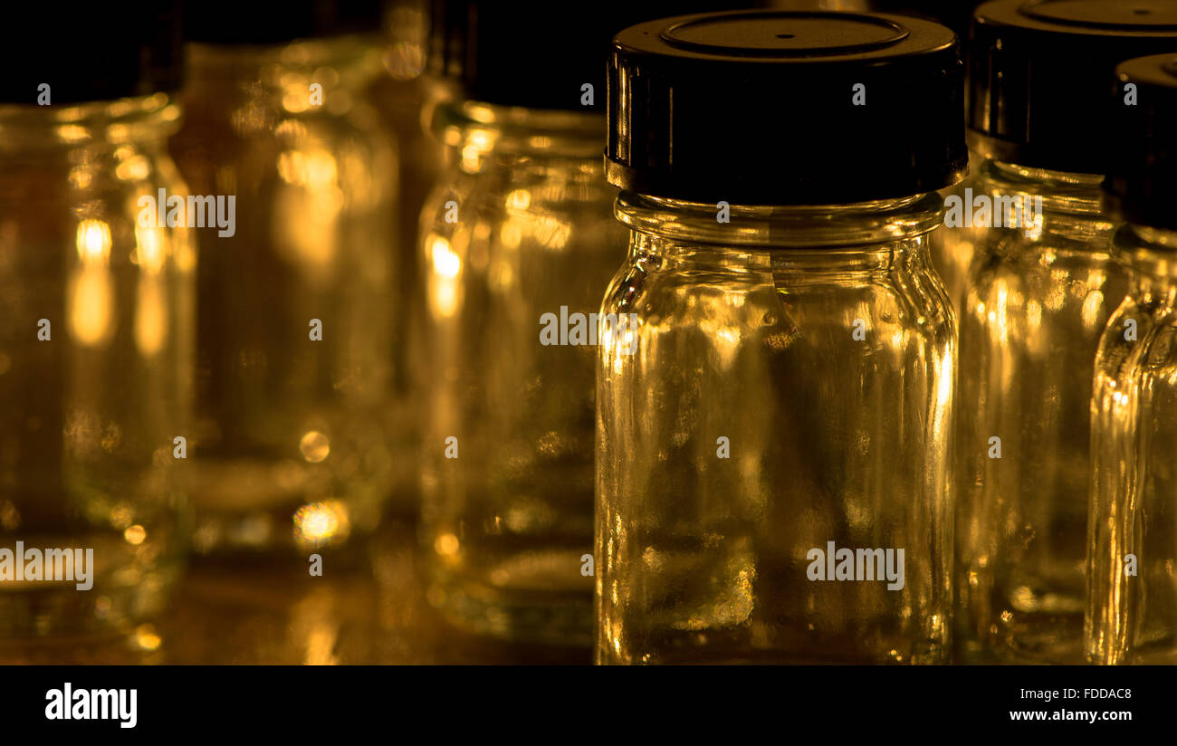 row of empty and small glass bottles Stock Photo - Alamy