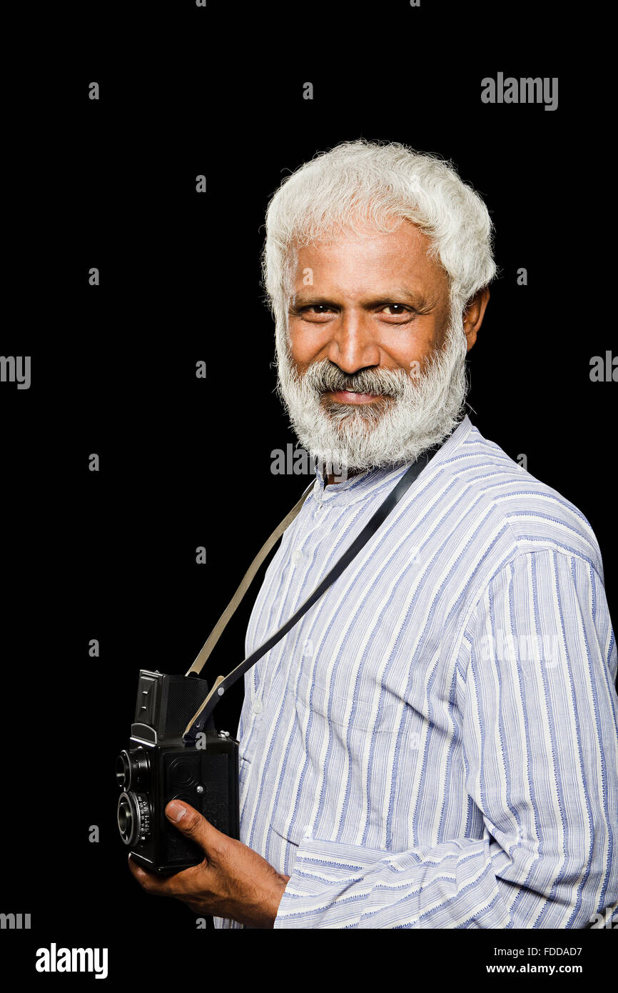 1 indian Senior Adult Cameraman Holding Camera standing Stock Photo - Alamy