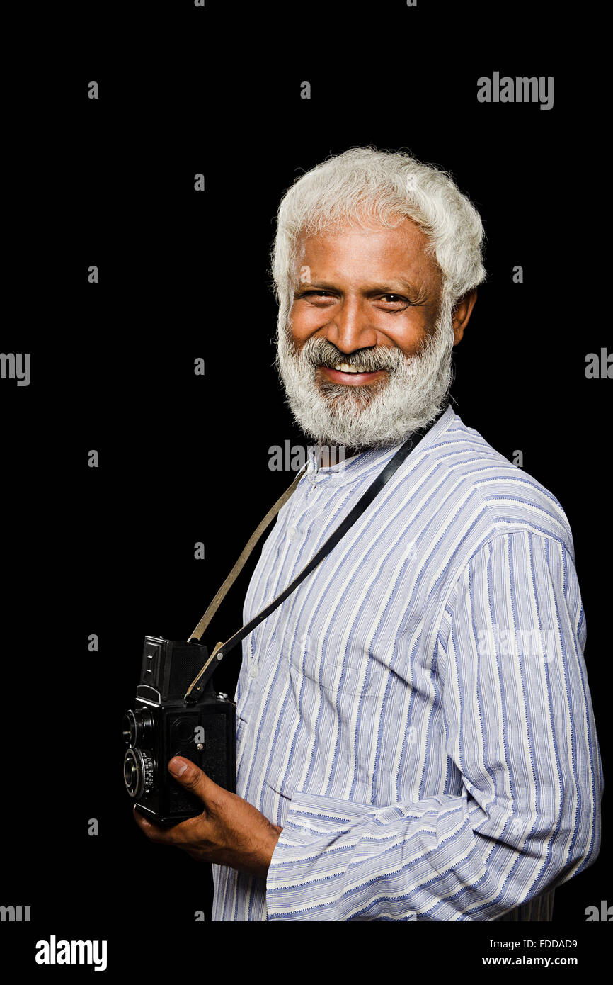1 indian Senior Adult Cameraman Holding Camera standing Stock Photo - Alamy