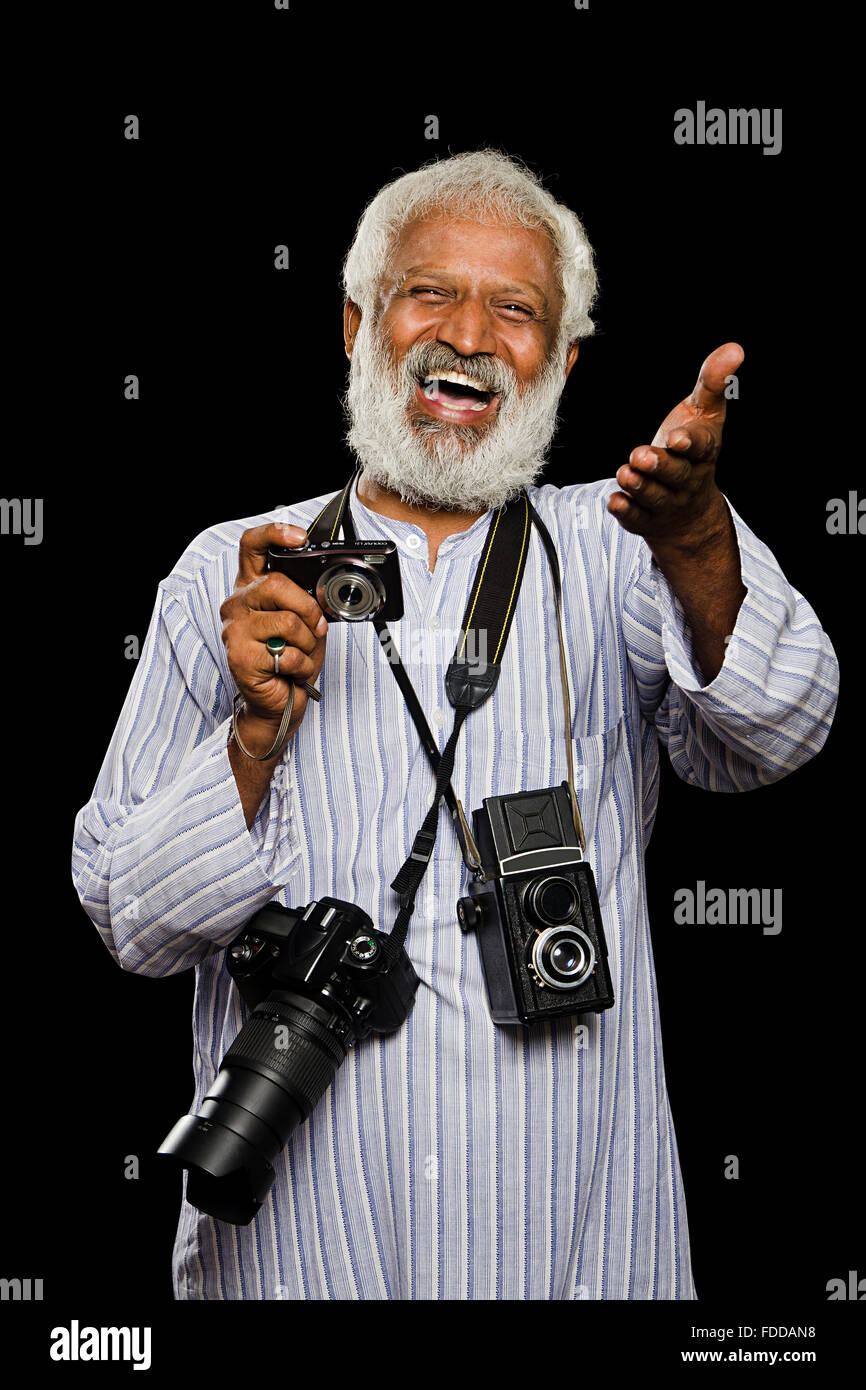 1 indian Senior Adult Cameraman hand gesturing showing camera Stock ...